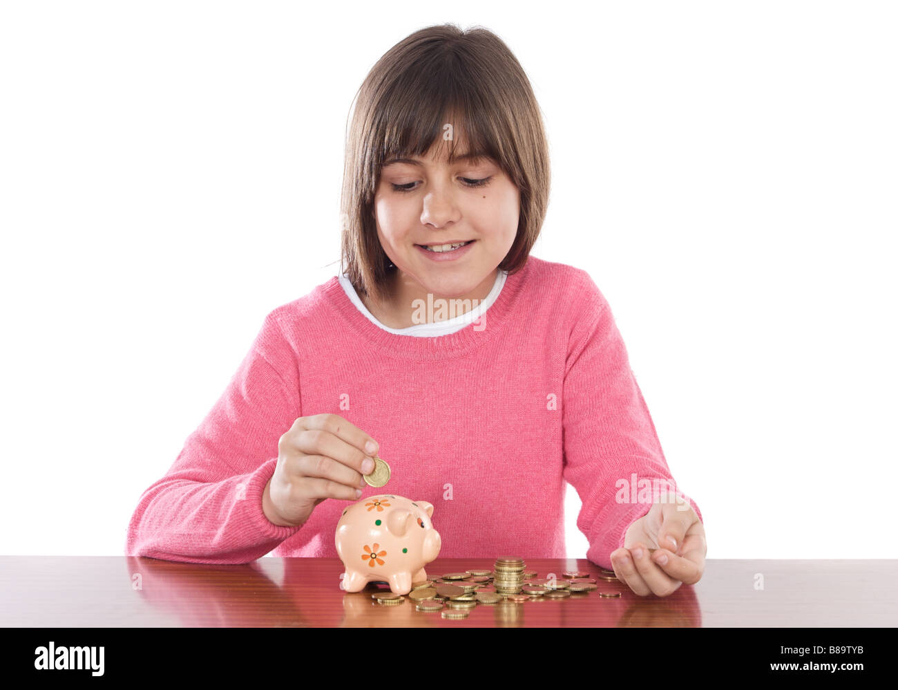Adorable girl with money box a over white background Stock Photo - Alamy