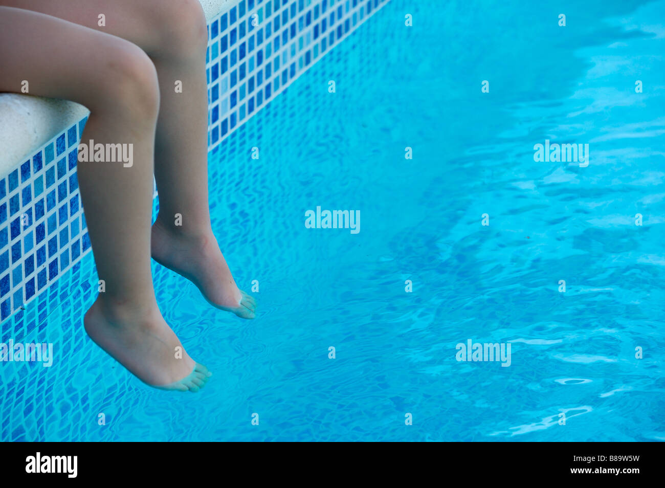 feet refreshing in swimming pool in summer Stock Photo - Alamy