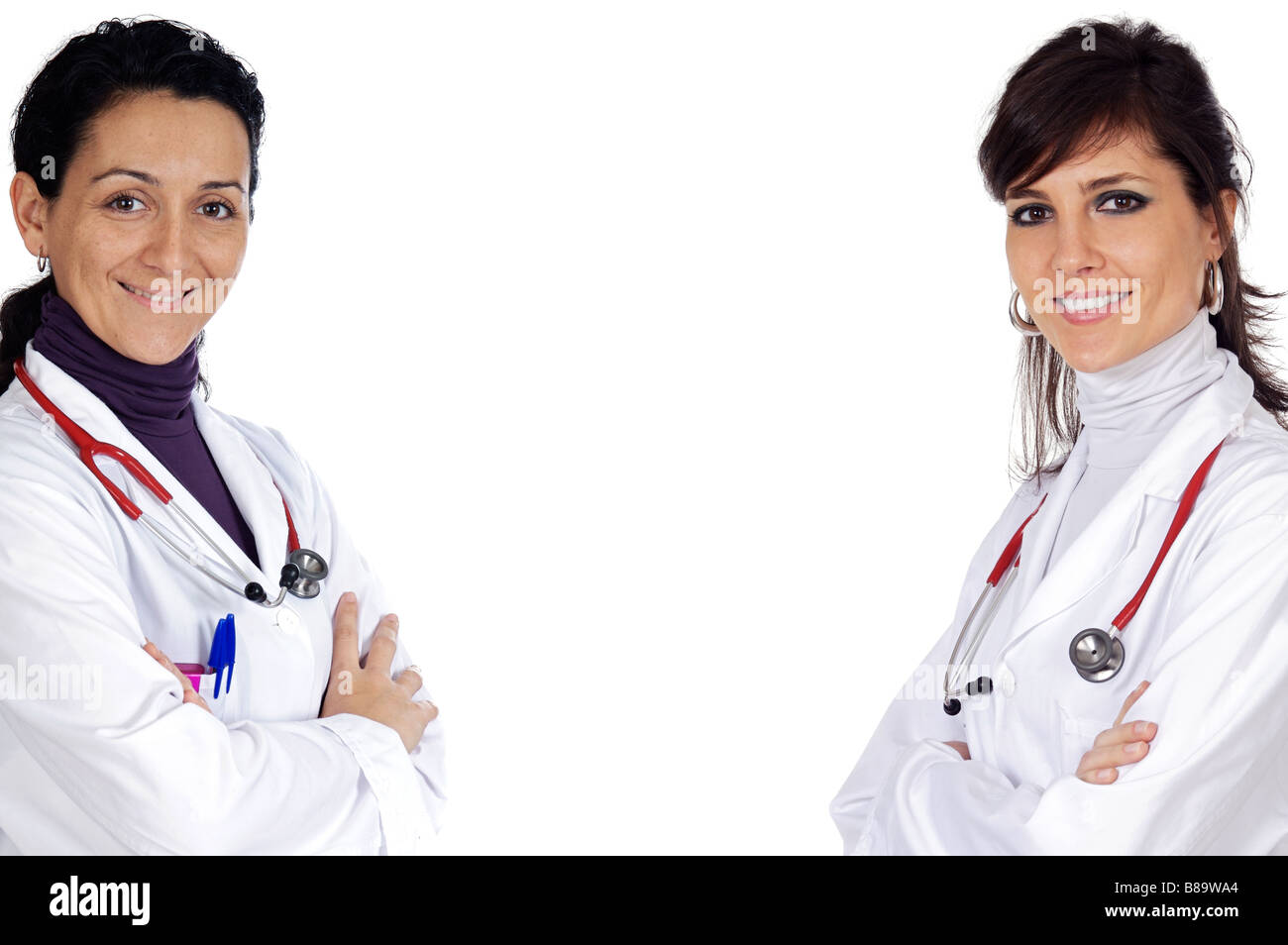 Two doctor women over a white background Stock Photo - Alamy