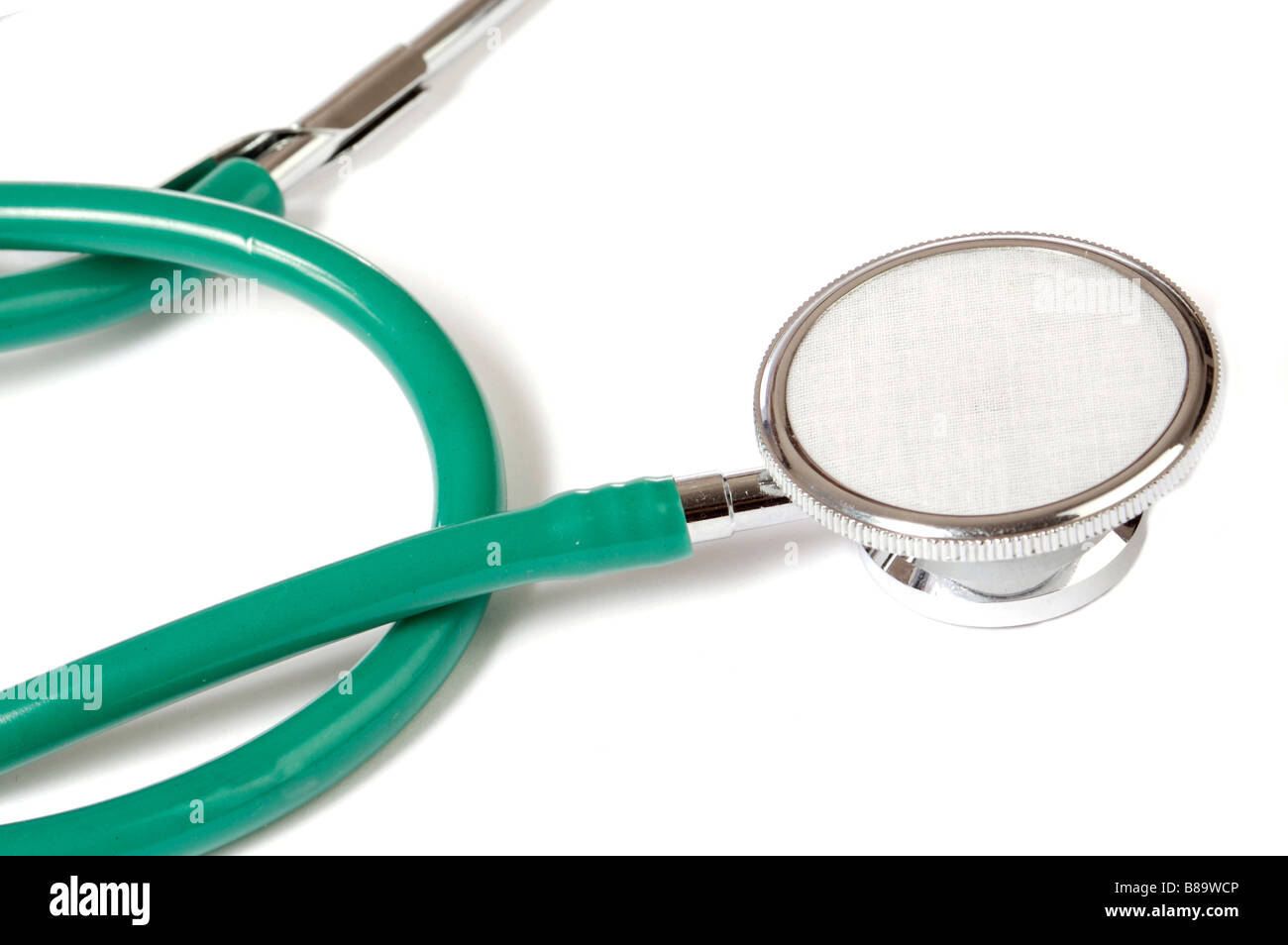 Green stethoscope isolated over white background Stock Photo - Alamy