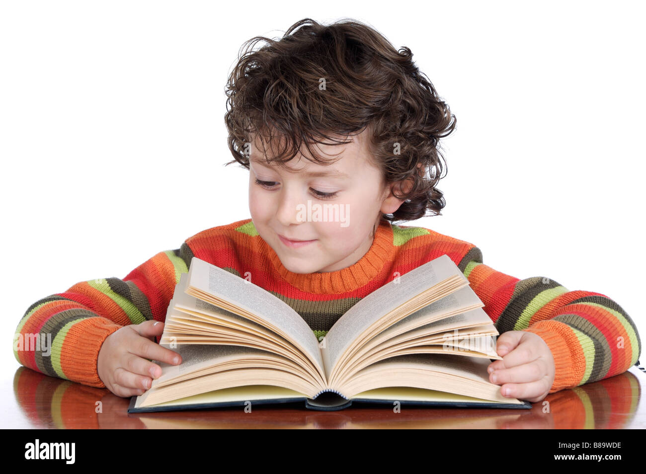 Adorable happy boy studying a over white background Stock Photo - Alamy