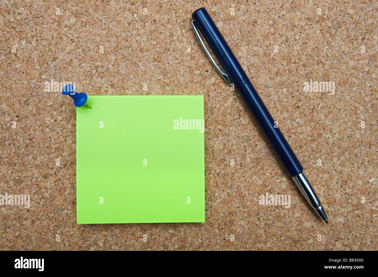 Photo of note posted and pen to a cork board Stock Photo - Alamy
