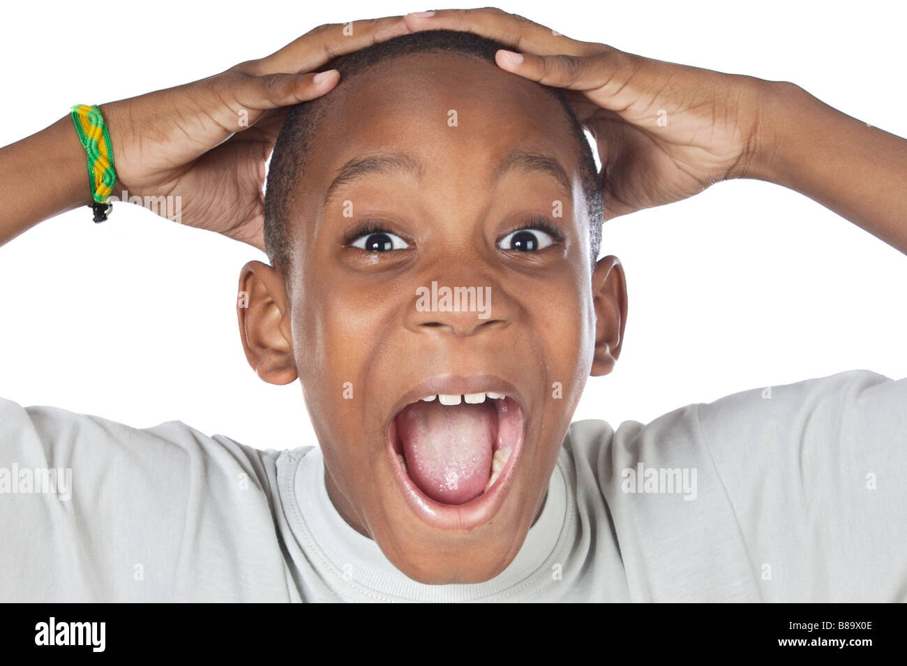 boy shouting madly with his hands over his head Stock Photo - Alamy