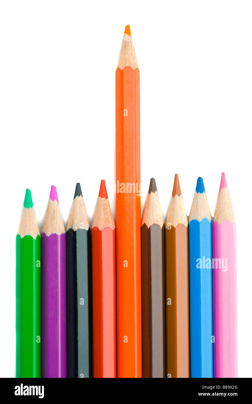 Joint crayons aligned with the orange leaving Stock Photo - Alamy