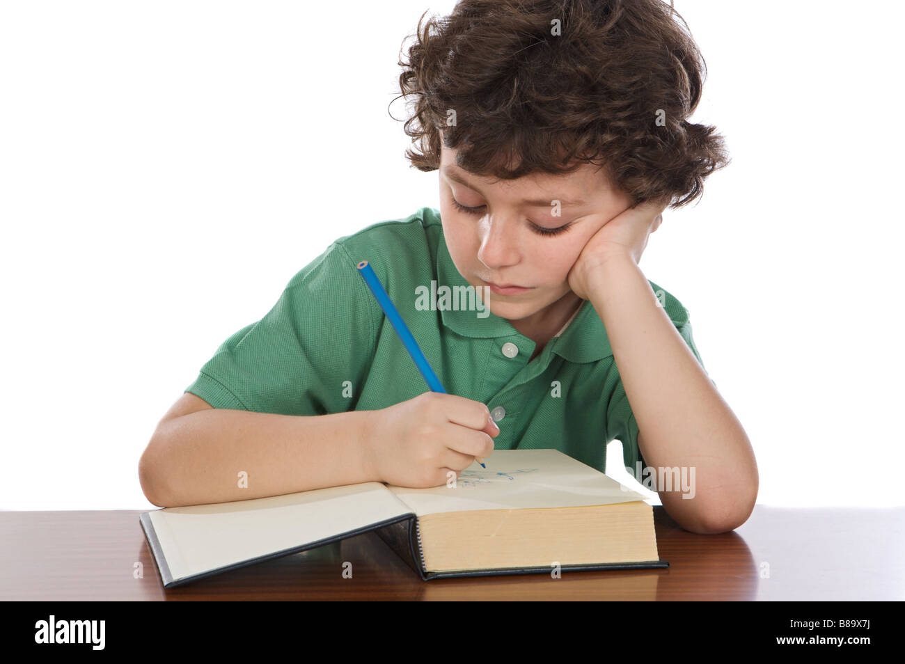 Adorable child write in book a over white background Stock Photo - Alamy