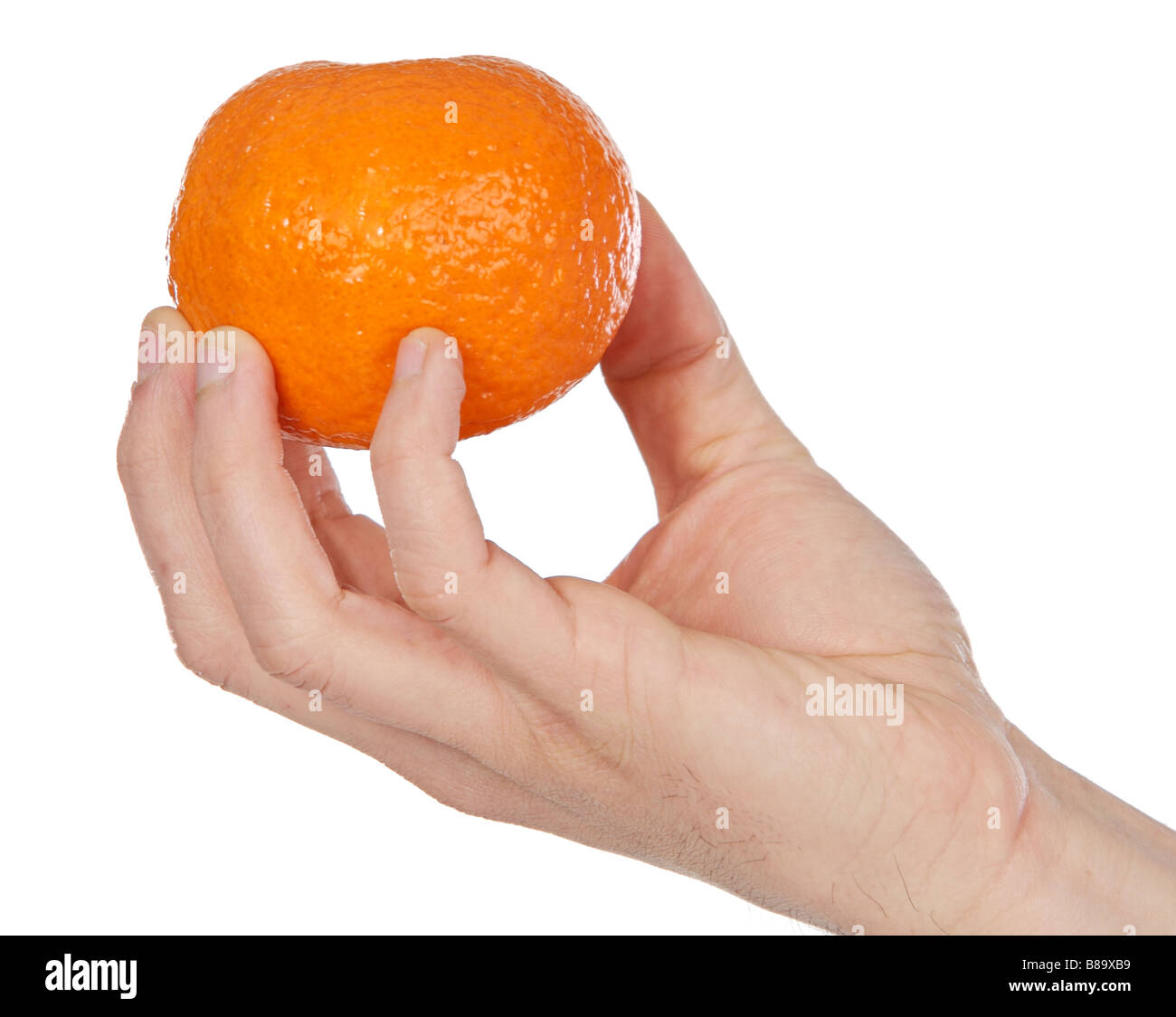 orange in a hand a over white background Stock Photo - Alamy