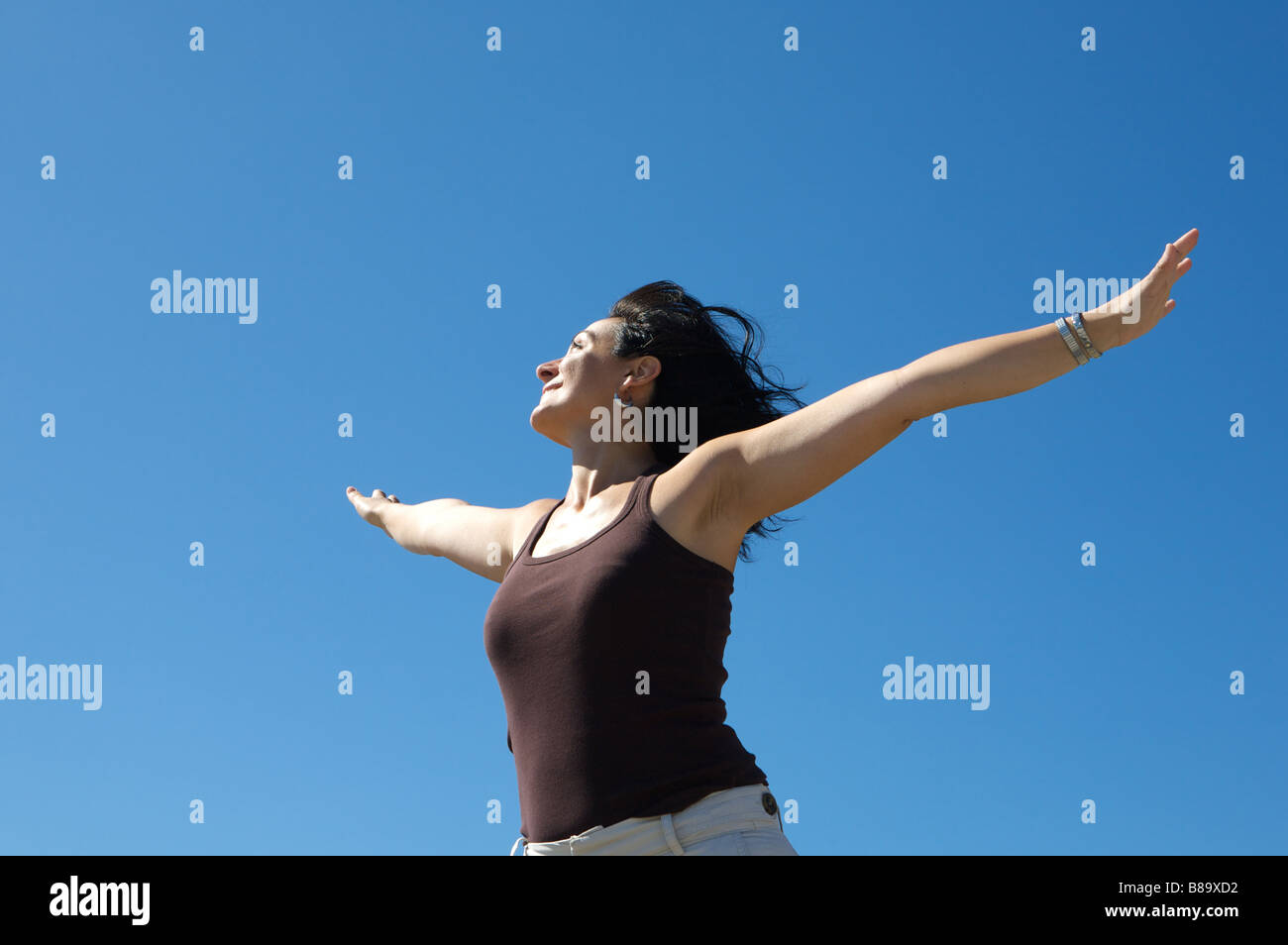 Photo of woman relaxing with sky background Stock Photo - Alamy