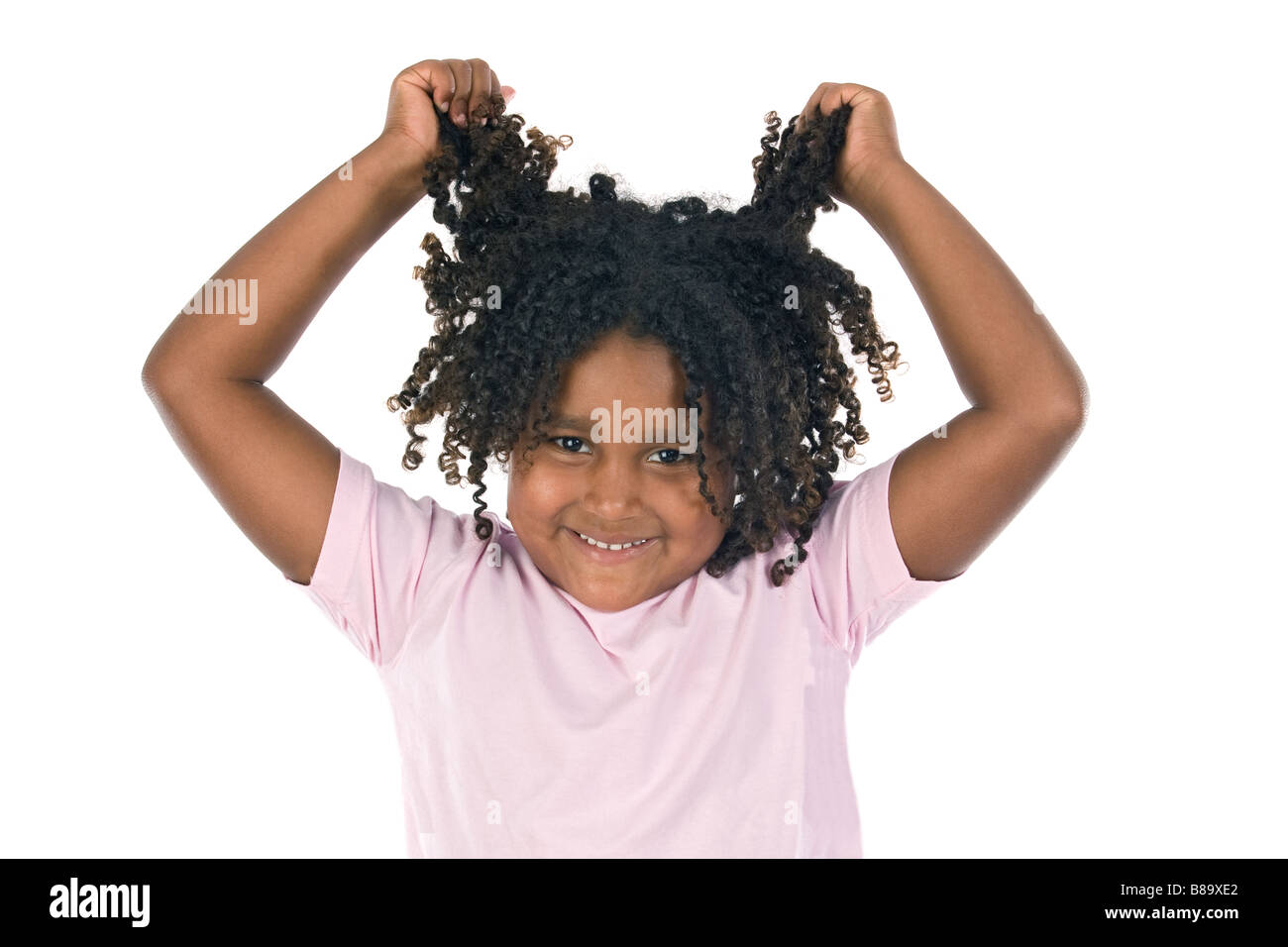 Adorable girl throw her hair on a over white background Stock Photo - Alamy
