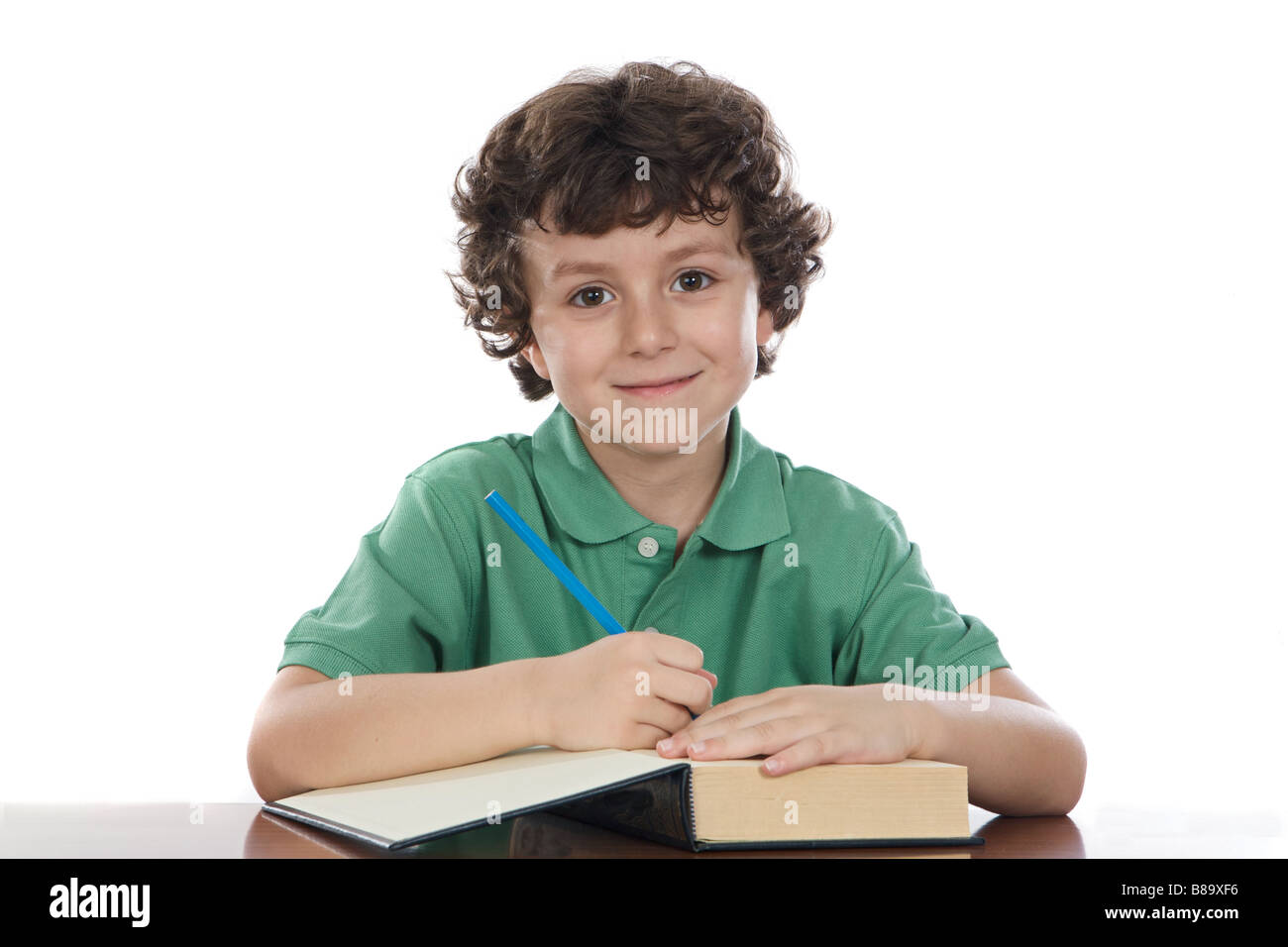 Adorable child write in book a over white background Stock Photo - Alamy