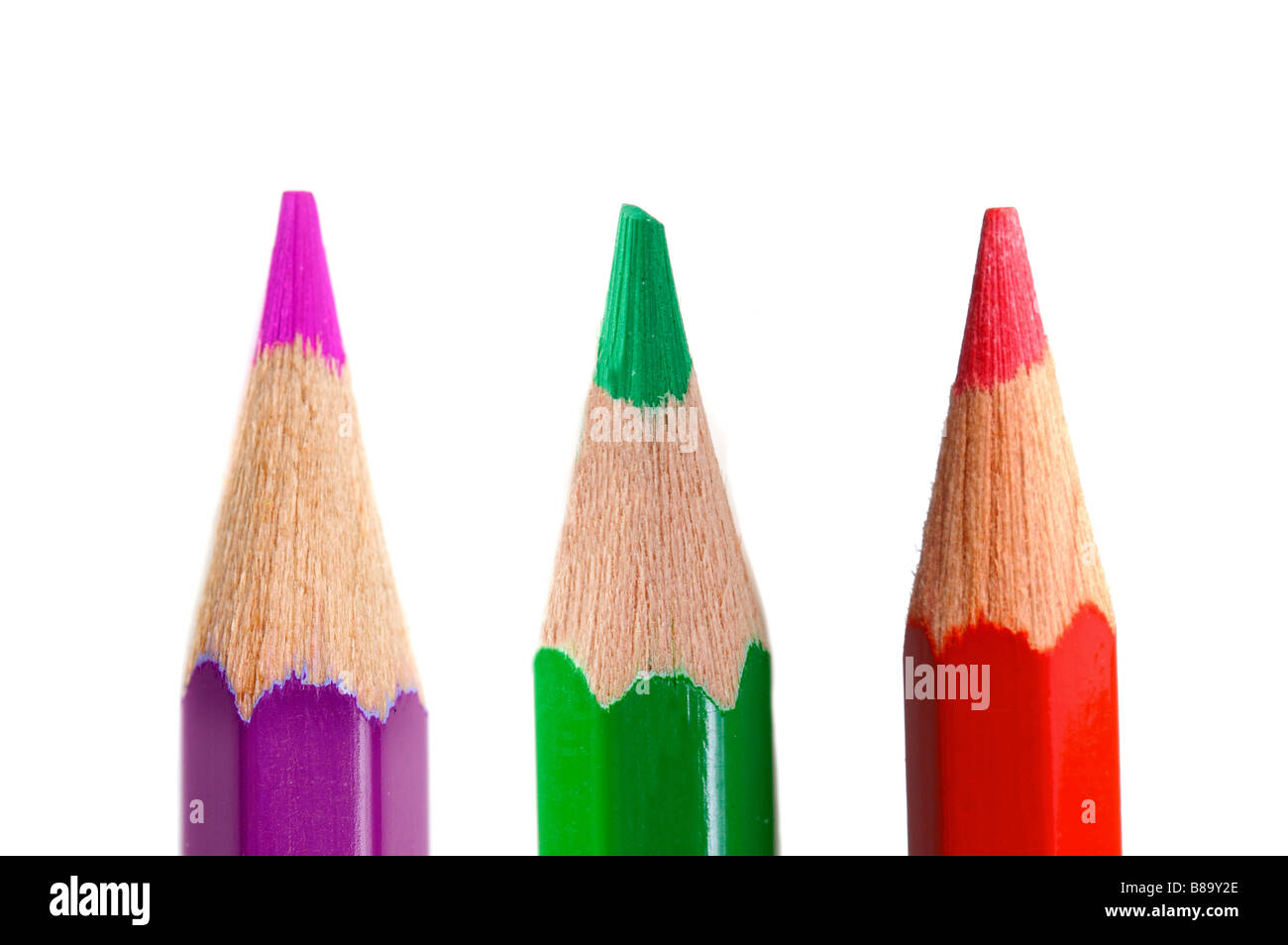 Three crayons vertically on a white background Stock Photo - Alamy