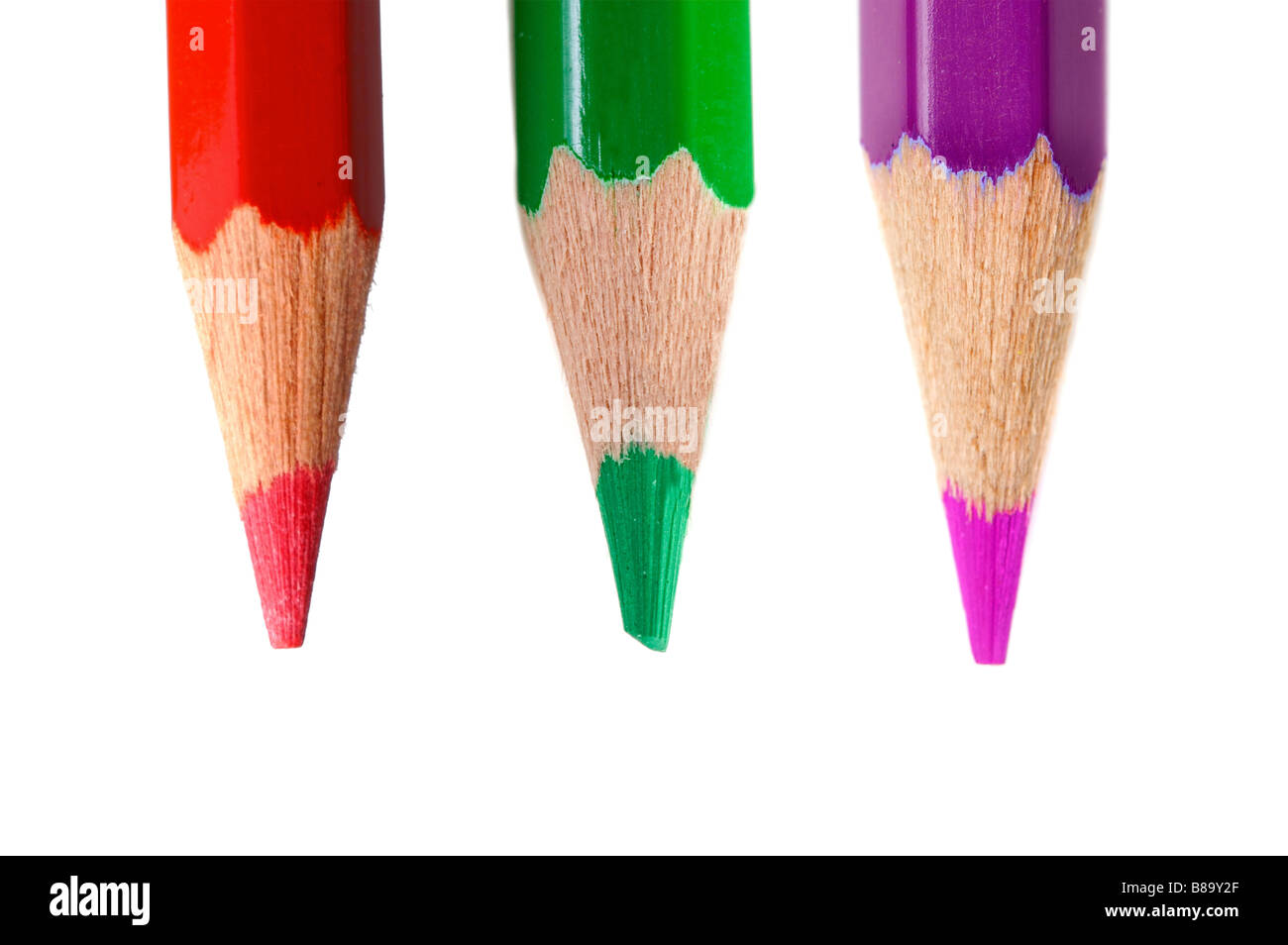 Three crayons vertically on a white background Stock Photo - Alamy