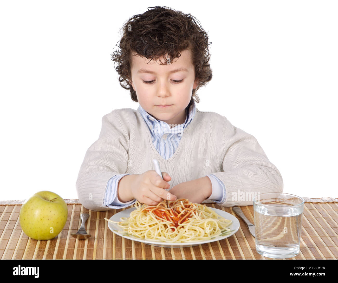 Adorable child hungry at the time of eating a over white background ...