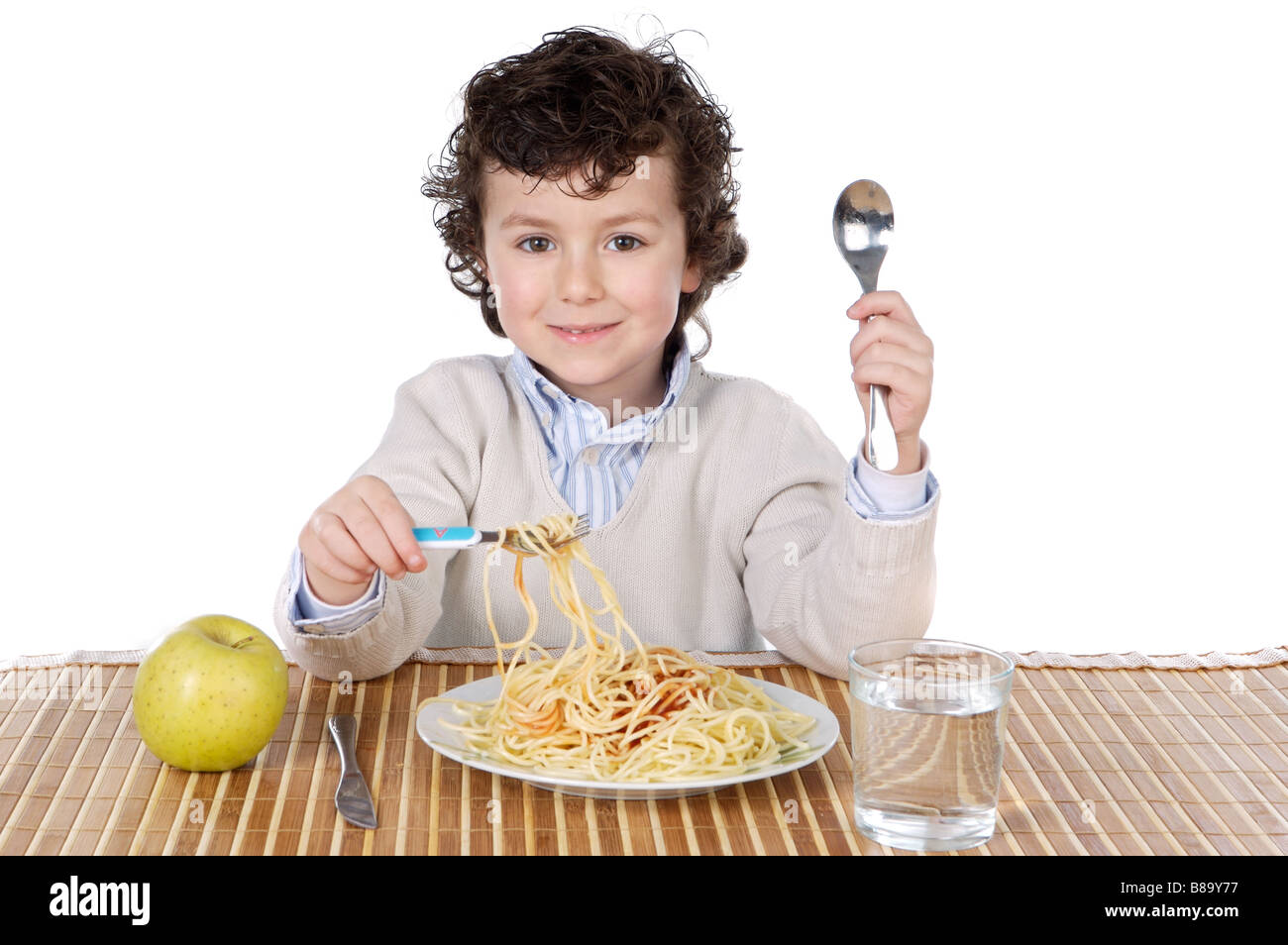 Adorable child hungry at the time of eating a over white background ...