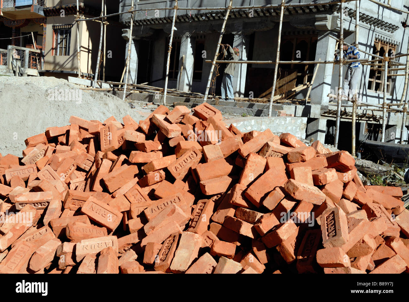 A building site with a modern concrete building being built so that it ...