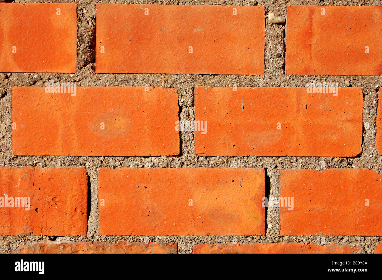 photo of a plain red Brick wall for background Stock Photo - Alamy
