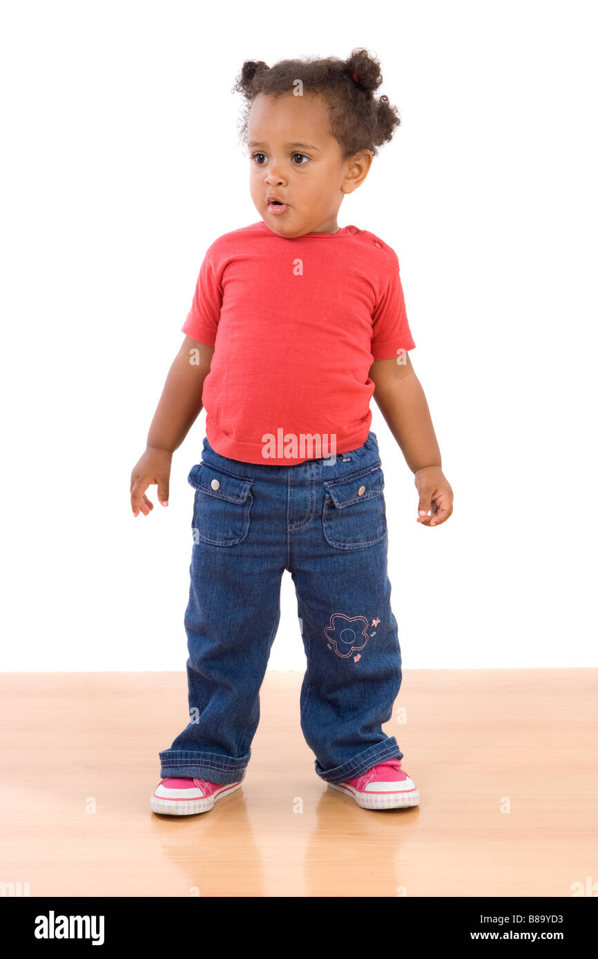Happy african baby standing over wooden floor Stock Photo - Alamy