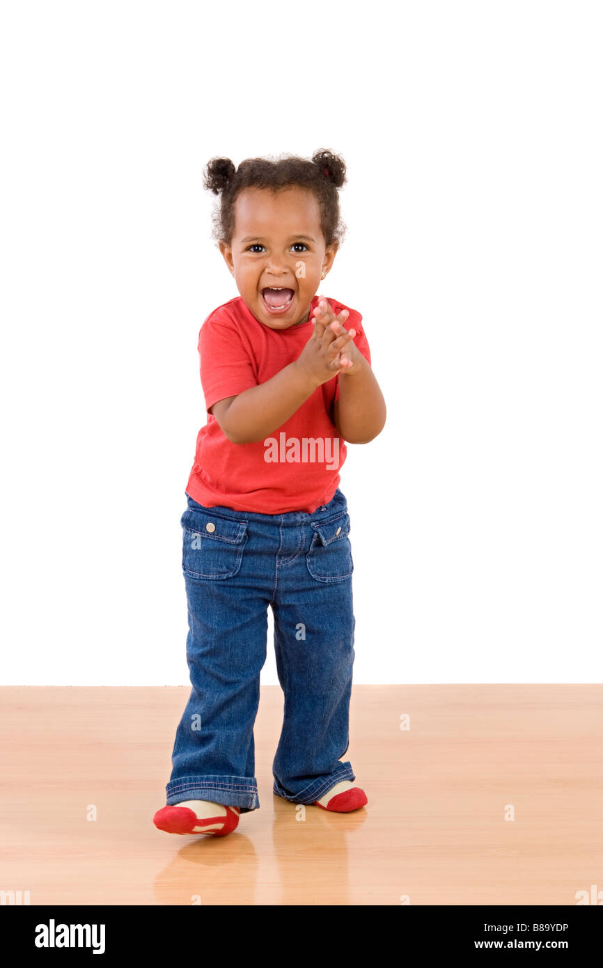 Adorable african baby stand over wooden floor Stock Photo - Alamy