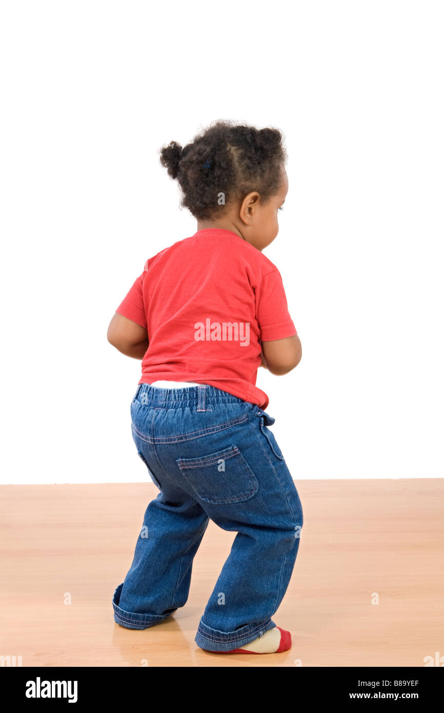 Adorable african baby dancing over wooden floor Stock Photo - Alamy