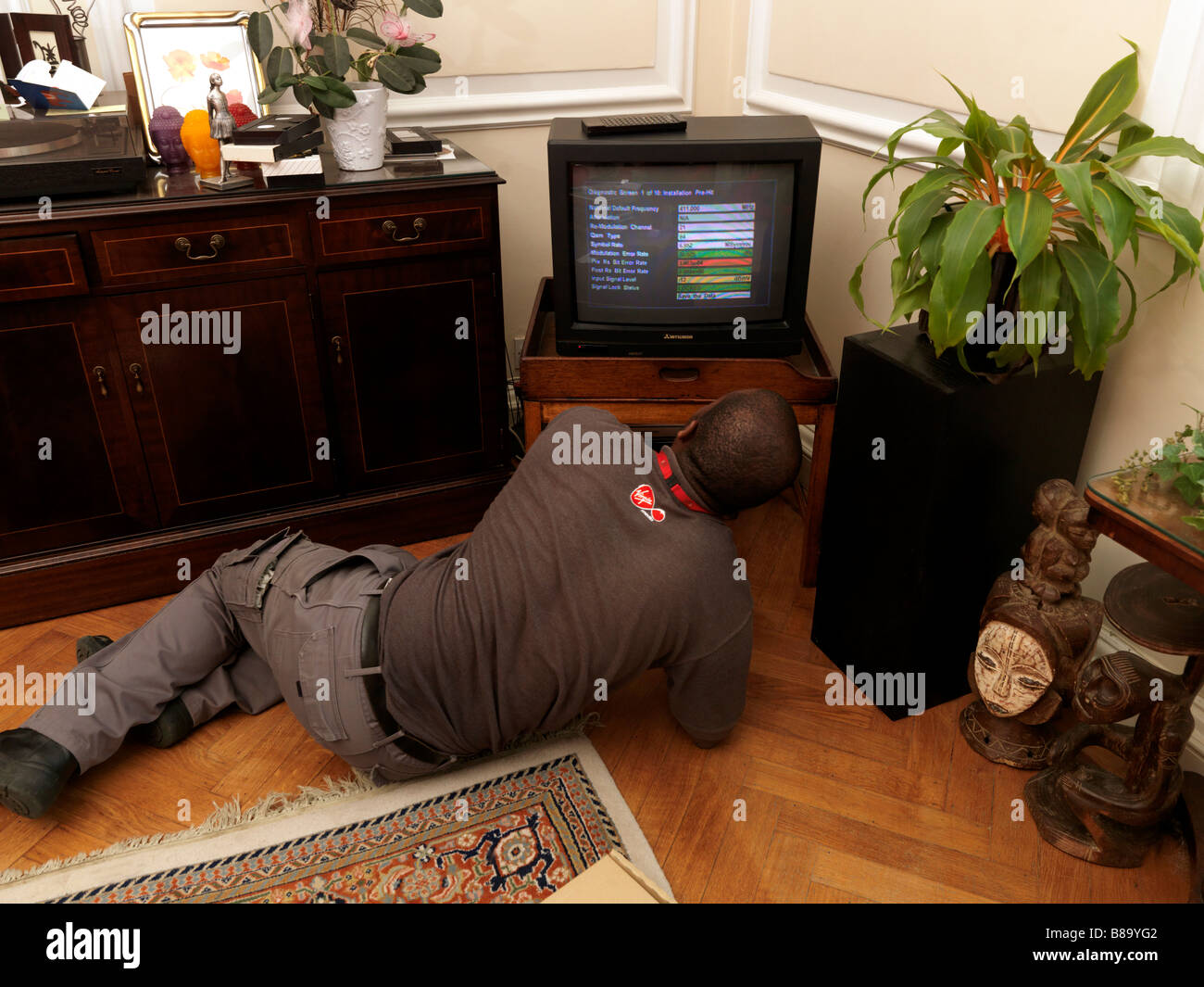 Installing A digital Cable Box in a Home Stock Photo - Alamy