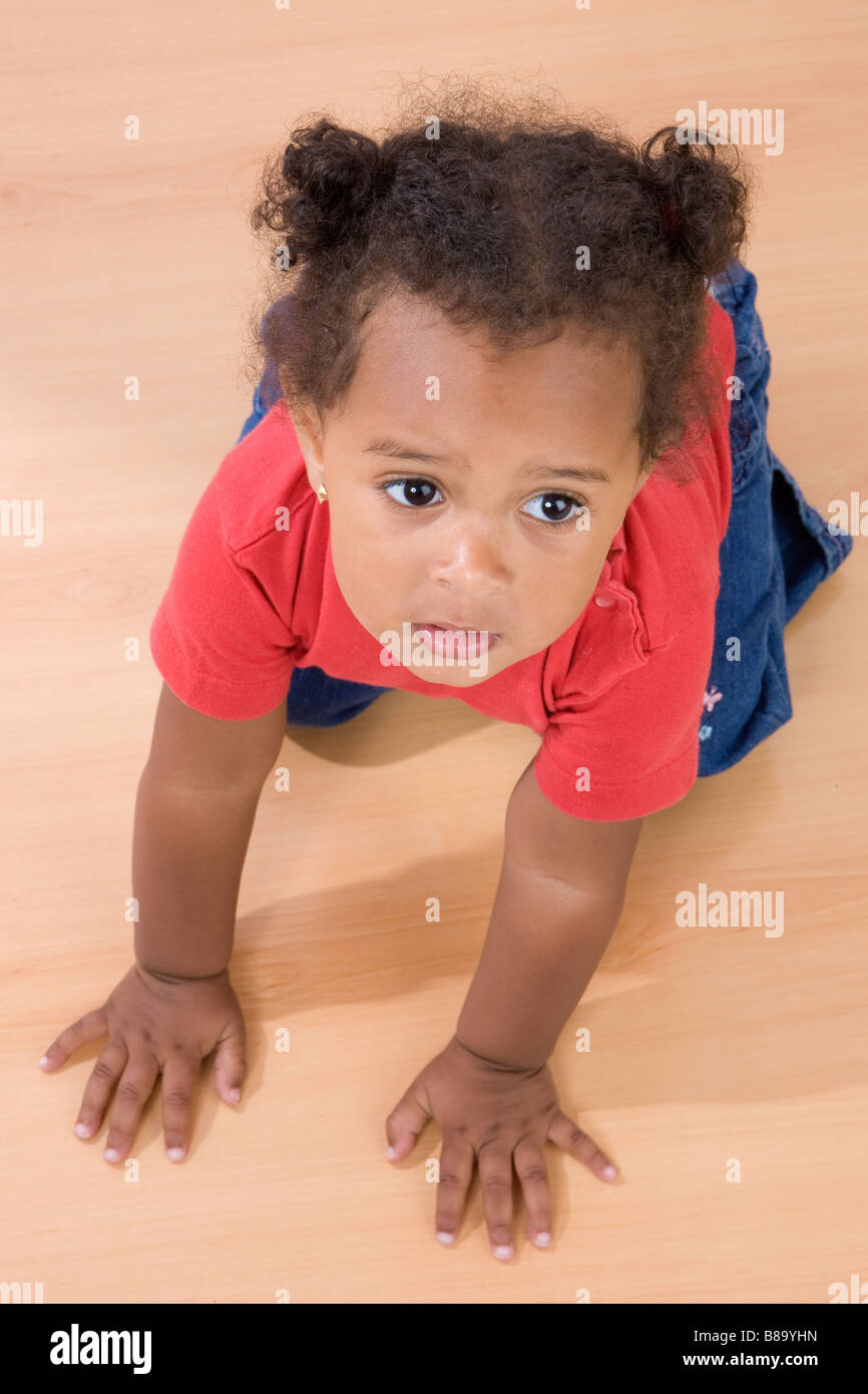 Baby crawling over wooden floor hi-res stock photography and images - Alamy