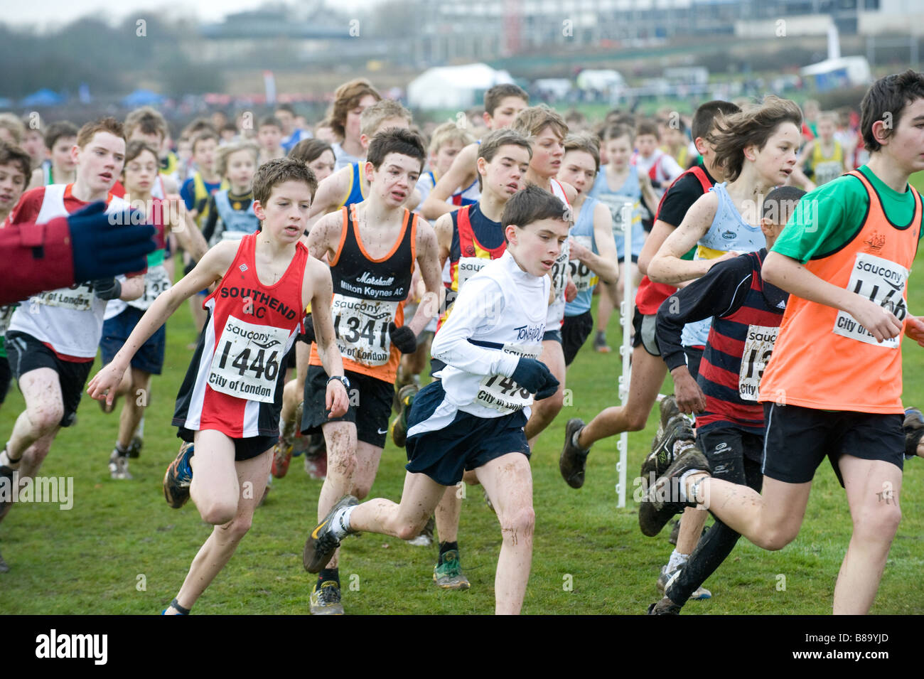 Mass of young athletes at start of cross country race Stock Photo - Alamy