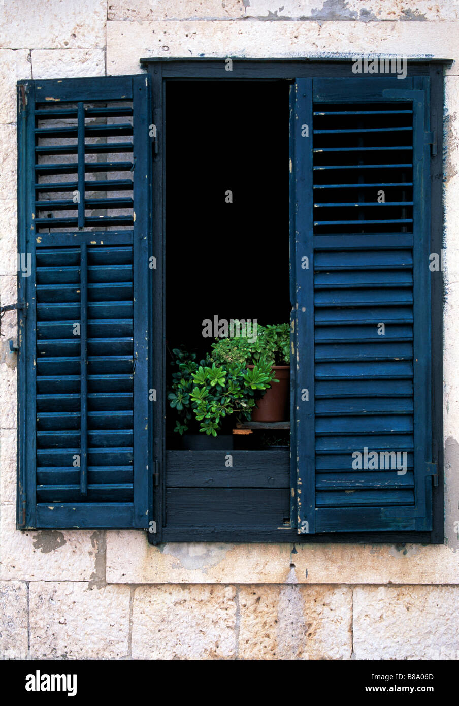 old house with half open shutters looking into dark room Stock Photo ...