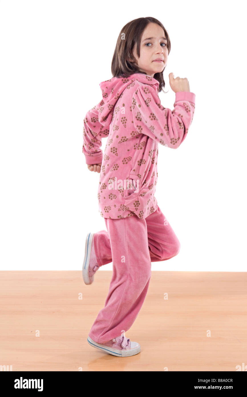 Joyful little girl running on a over white background Stock Photo - Alamy