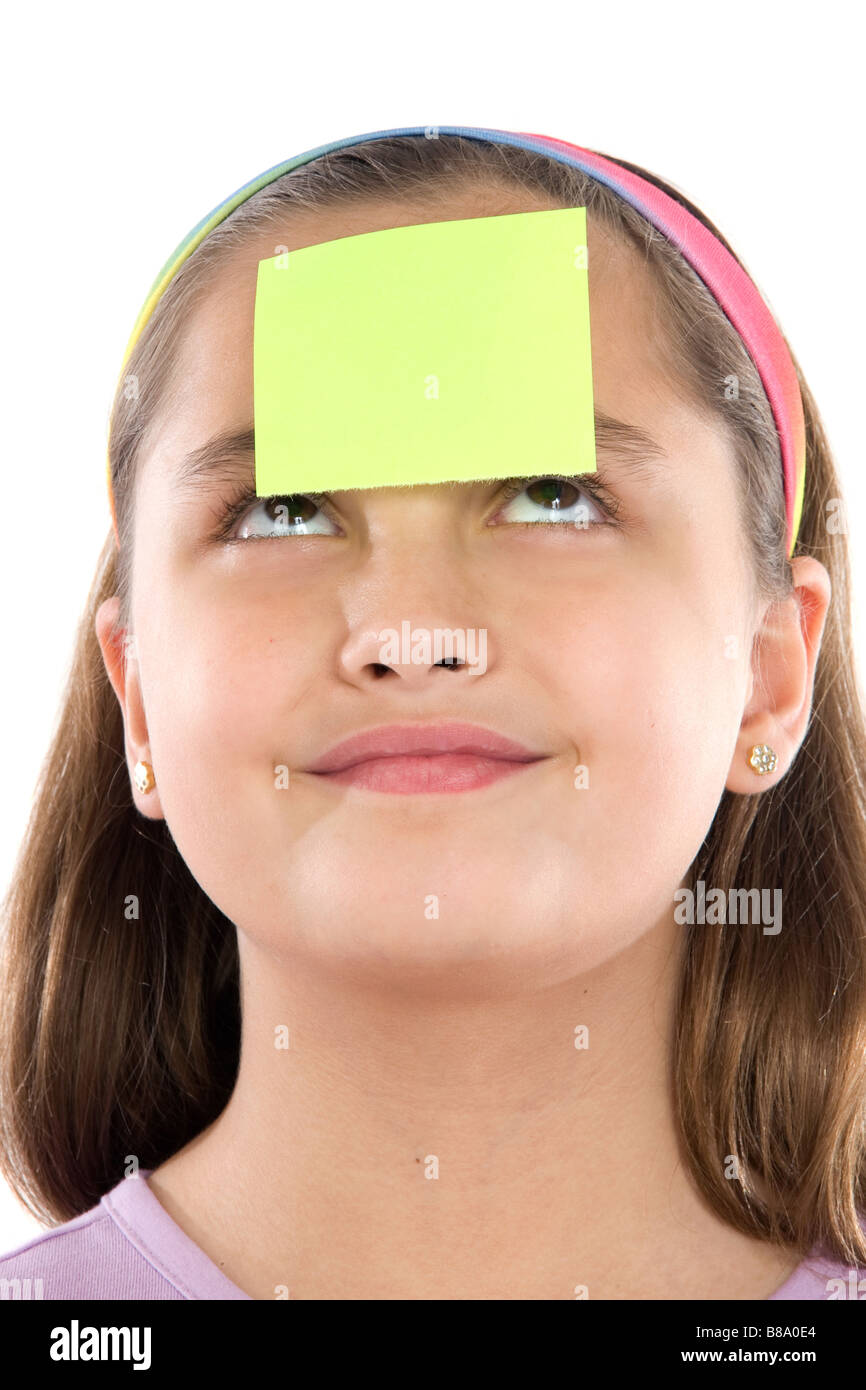 Adorable girl with post it in her front isolated over white Stock Photo ...