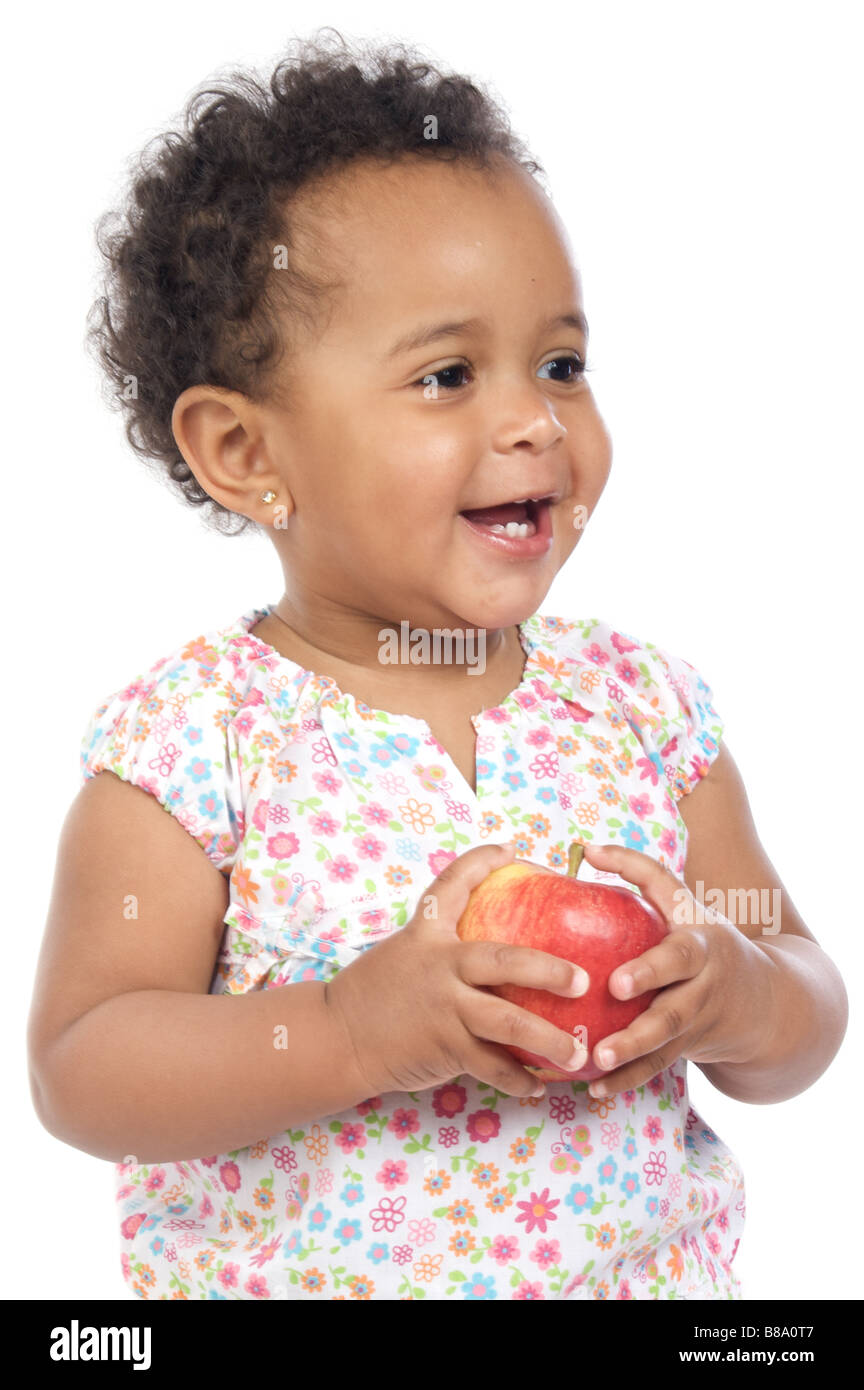 adorable baby with an apple a over white background Stock Photo - Alamy