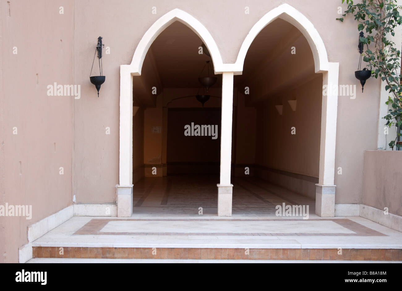 Double Arched Entrance to Hotel Passageway Stock Photo - Alamy