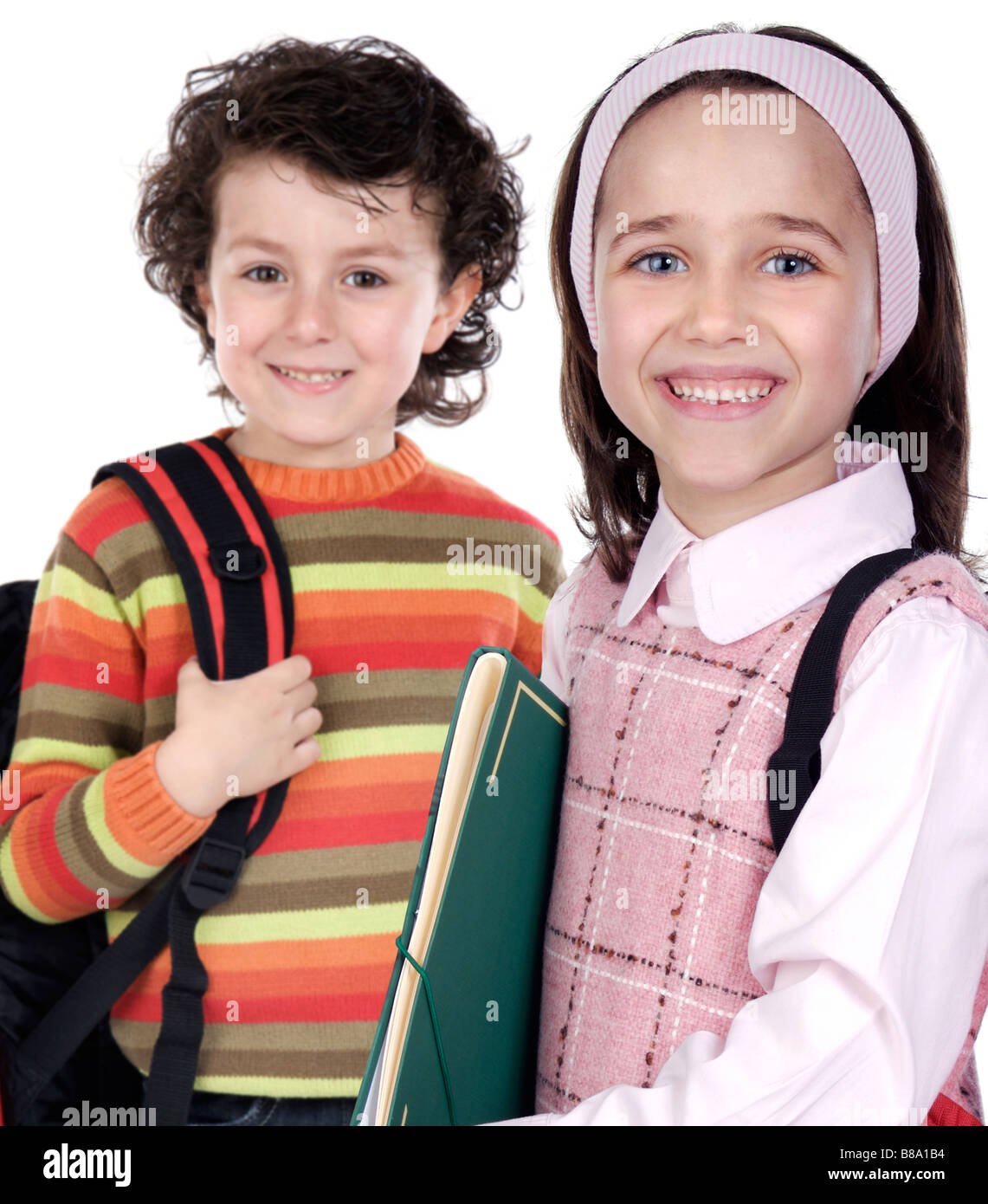Two smalls students a over white background Stock Photo - Alamy