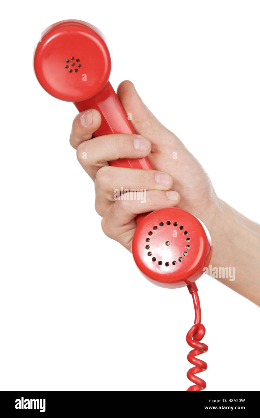 hand holding red telephone a over white background Stock Photo - Alamy