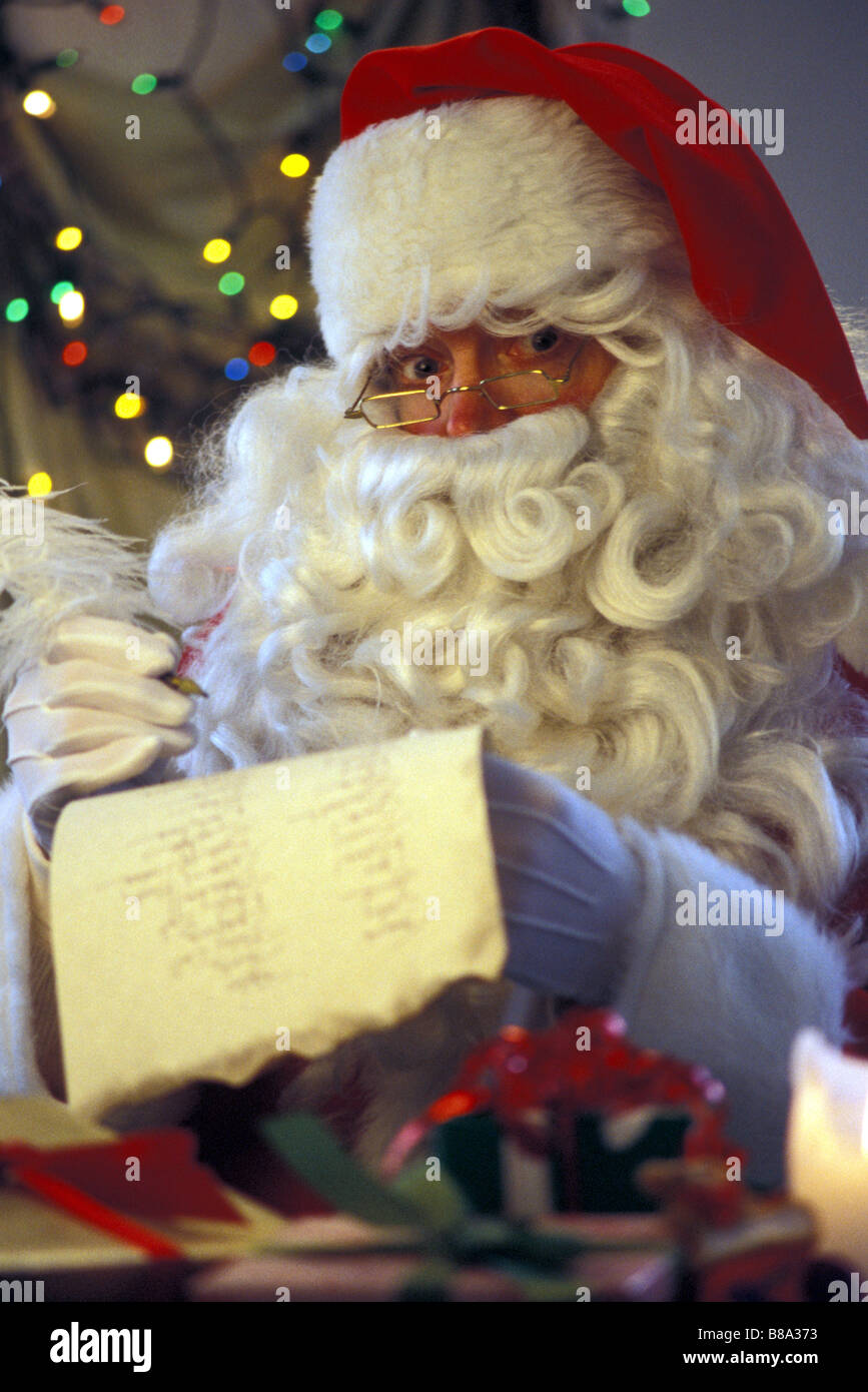 Santa Claus with list Stock Photo - Alamy