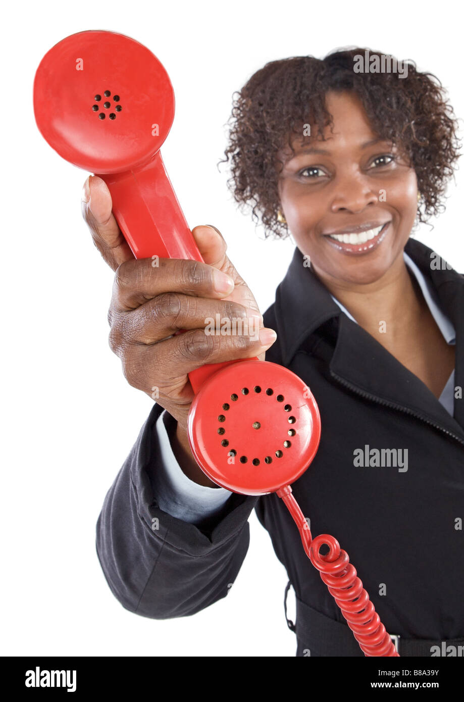 Woman with a red phone a over white background Stock Photo - Alamy
