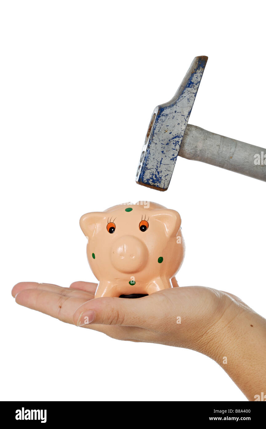 photo of a hammer breaking a moneybox Stock Photo - Alamy