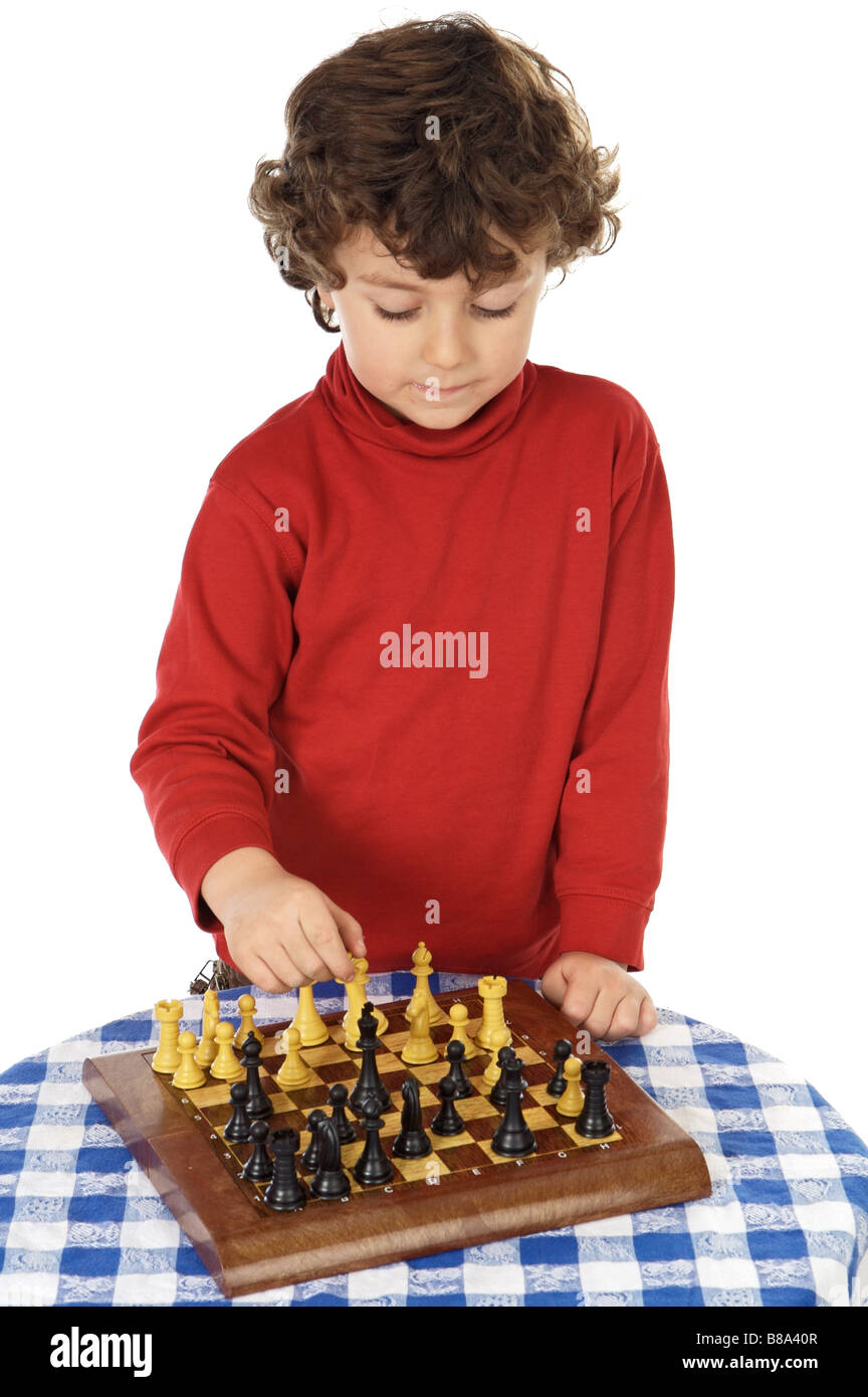 Photo of an adorable boy playing the chess Stock Photo - Alamy