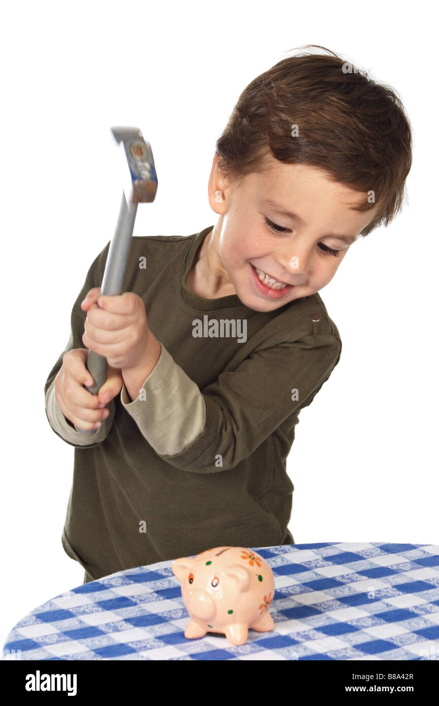 photo of an adorable boy breaking the money box Stock Photo - Alamy