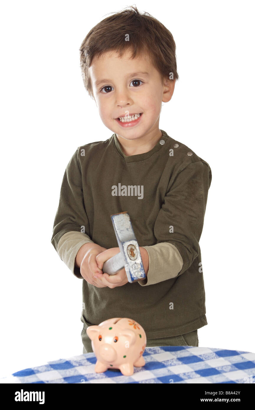 photo of an adorable boy breaking the money box Stock Photo - Alamy