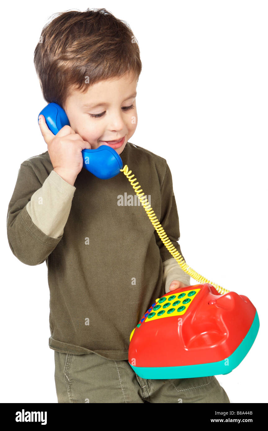 photo of an adorable boy speaking on the telephone Stock Photo - Alamy