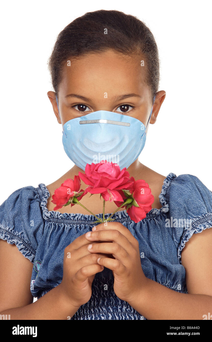 Cute girl with mask isolated in white Stock Photo - Alamy