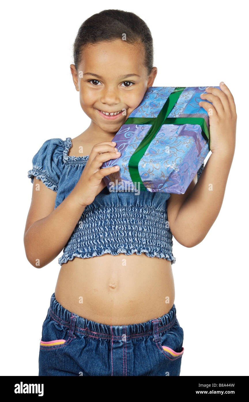 girl giving a gift a over white background Stock Photo - Alamy