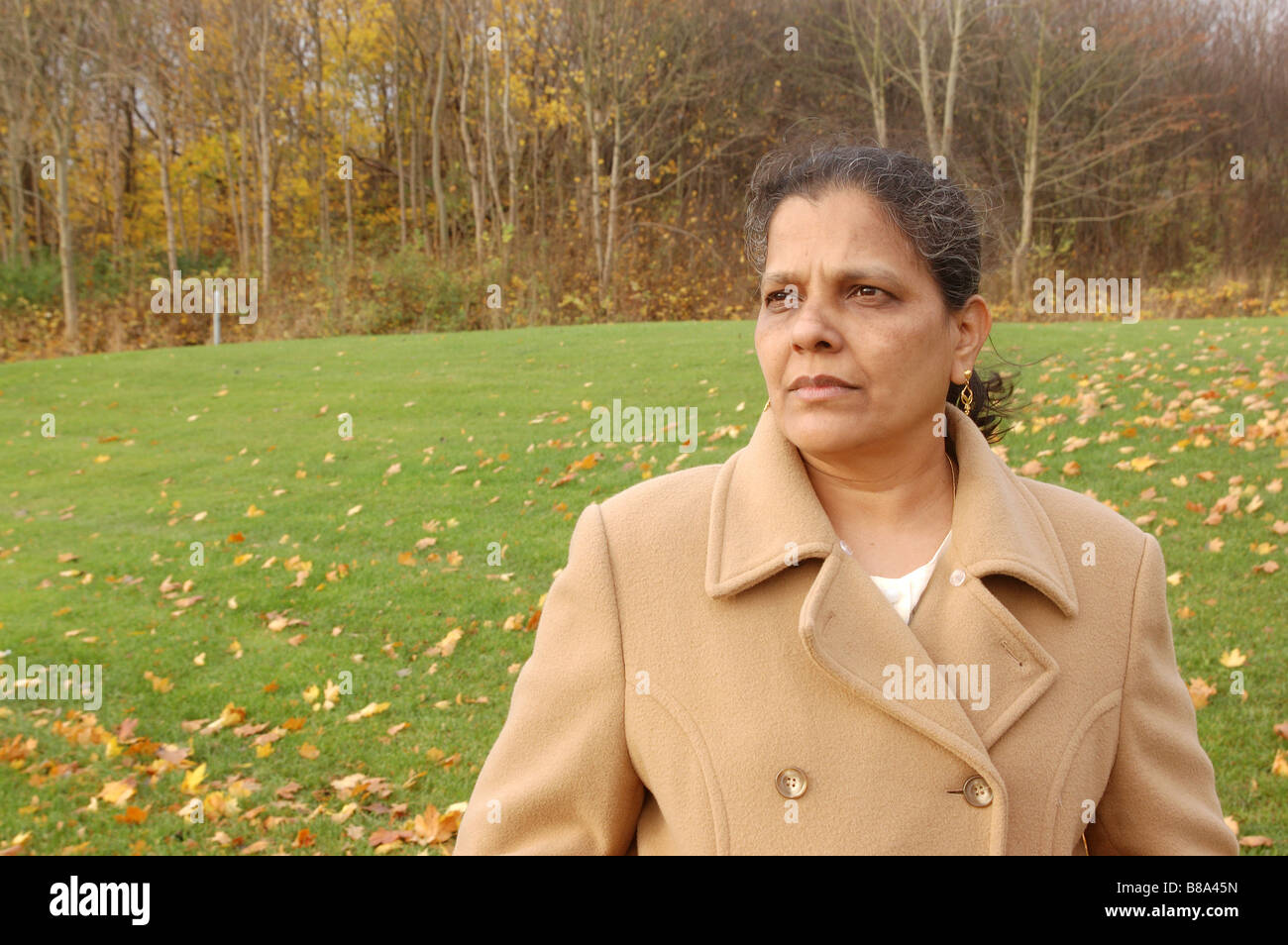 Old middle age lady wearing overcoat standing and looking MR # 468 ...