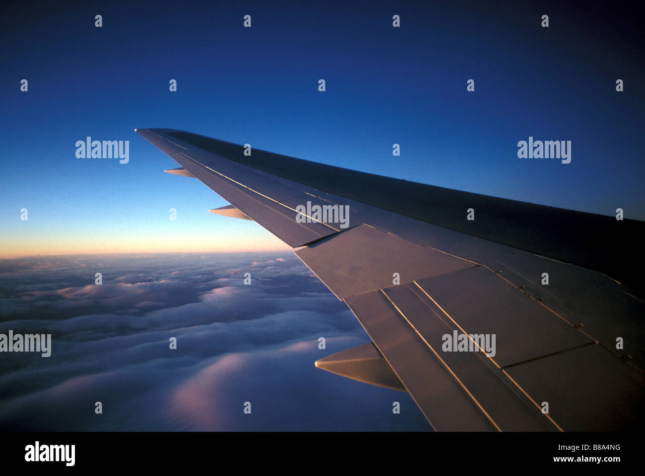 Jet Plane Wing from Cabin Window in Flight Stock Photo - Alamy