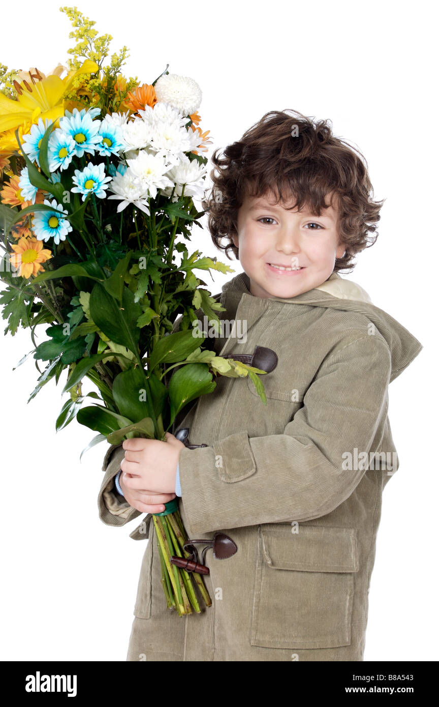 adorable boy with flowers a over white background Stock Photo - Alamy