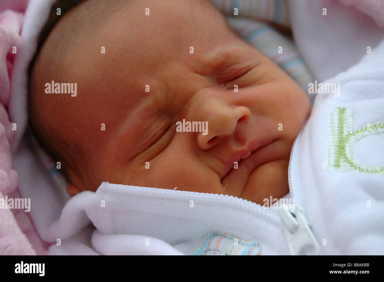 One week old baby girl sleeping disturbed Stock Photo - Alamy