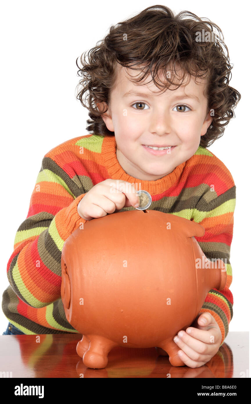 adorable boy putting its savings in your money box Stock Photo - Alamy
