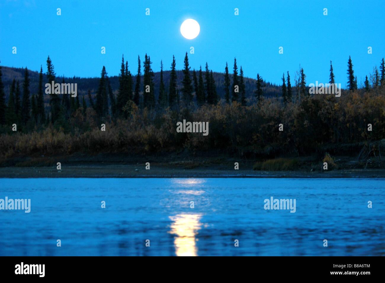 Full moon rising over Malemute Fork of Alatna river Alaska Stock Photo ...