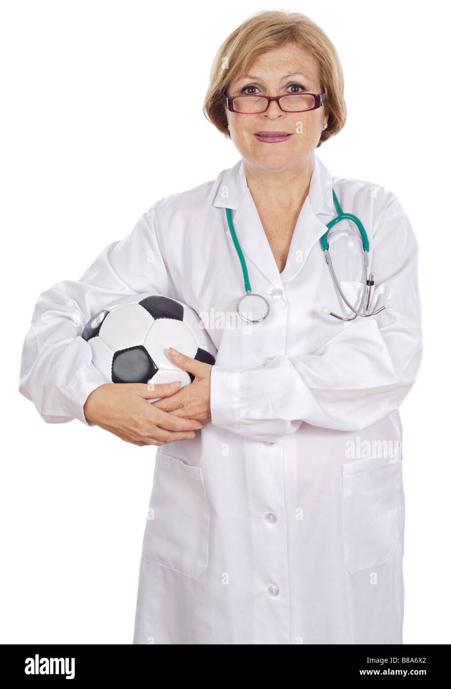 Female doctor holding soccer ball over white background Stock Photo - Alamy