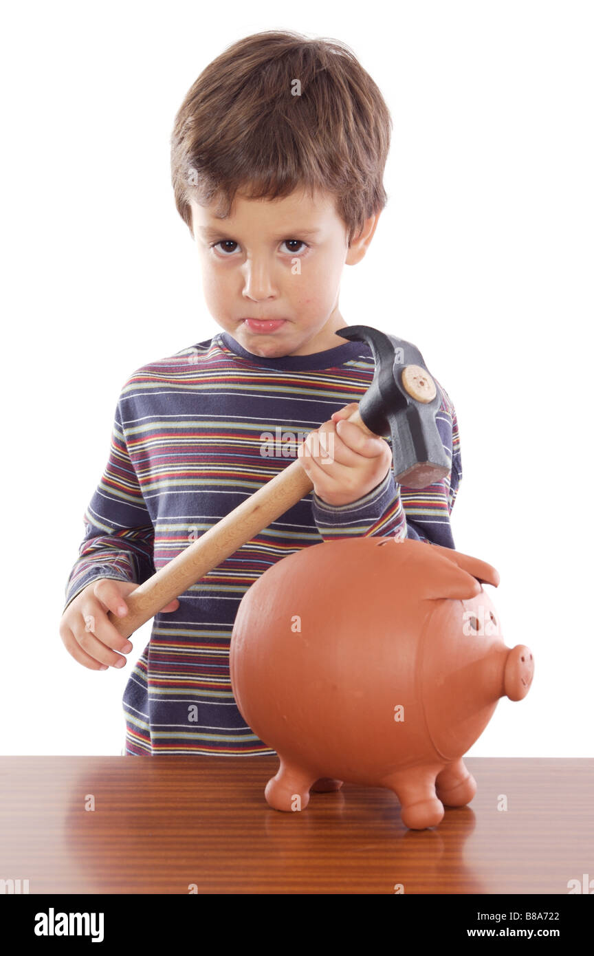 photo of an adorable boy breaking the money box Stock Photo - Alamy