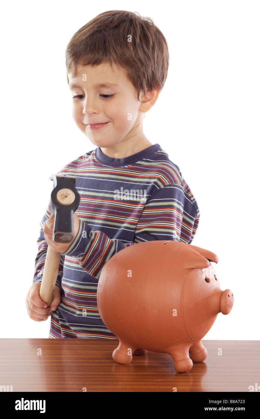 photo of an adorable boy breaking the money box Stock Photo - Alamy